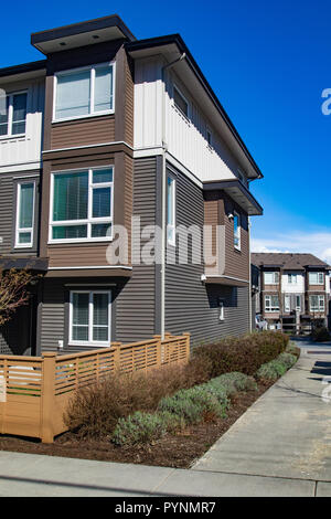 Street with modern low-rise apartment building Stock Photo - Alamy