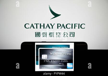 Cathay Pacific credit card displayed on a smartphone in front of a ...