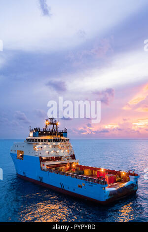 Industrial offshore anchor handling supply vessel sailing in open sea ...