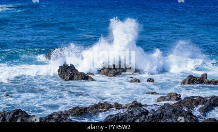 Sea spray over Rocks Stock Photo - Alamy