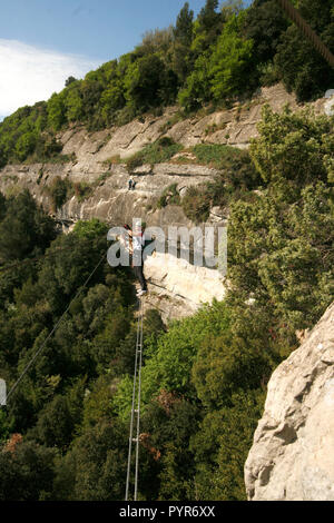 Mountain climber ascending the Via Ferrata Marino Bianchi climbing ...