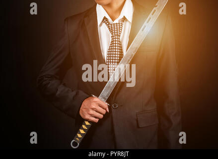 Hand holding sword Stock Photo - Alamy