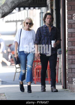Actress Malin Akerman and fiance Jack Donnelly hold hands after a ...