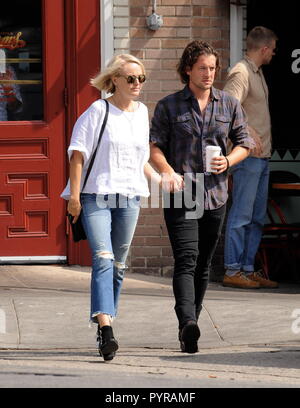 Actress Malin Akerman and fiance Jack Donnelly hold hands after a ...