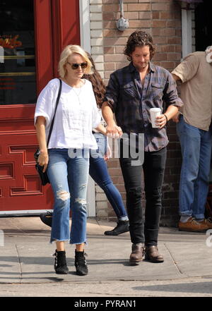 Actress Malin Akerman and fiance Jack Donnelly hold hands after a ...