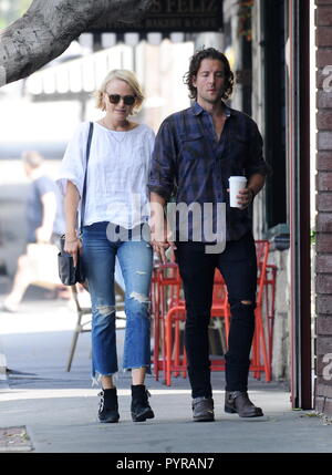 Actress Malin Akerman and fiance Jack Donnelly hold hands after a ...