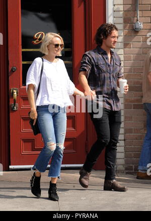 Actress Malin Akerman and fiance Jack Donnelly hold hands after a ...