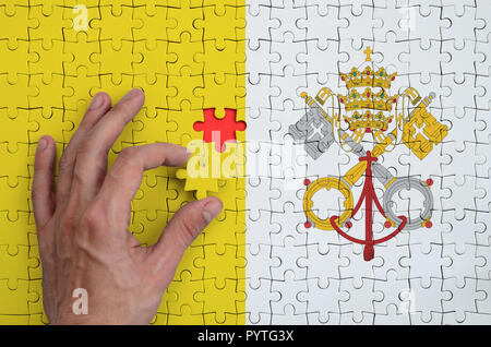 Vatican City State flag depicted on many small shiny sequins. Colorful ...