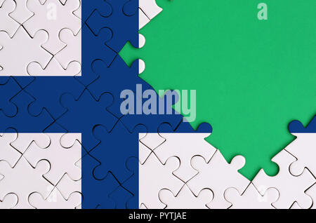 Finland flag depicted on side part of military armored tank close up ...