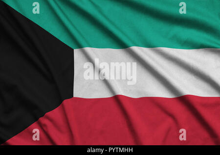 Kuwait flag with big folds waving close up under the studio light ...