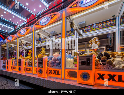 Toy grab claw machine at a funfair arcade Stock Photo - Alamy