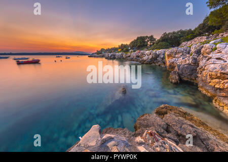 Sunset over the rocky Croatian coast in Dubrovnik, Croatia Stock Photo ...