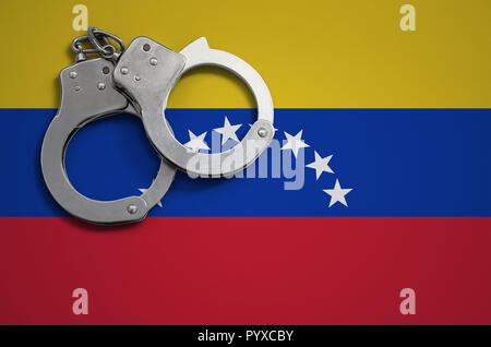 Venezuela flag and police handcuffs. The concept of crime and offenses ...