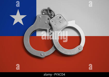 Chile flag and police handcuffs. The concept of crime and offenses in ...
