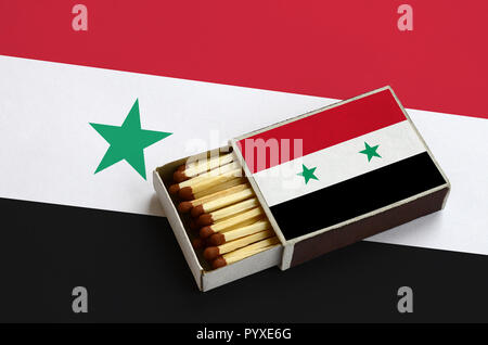 Syria flag is shown in an open matchbox, which is filled with matches ...