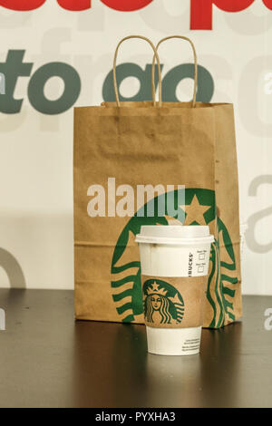 Cup of Starbucks coffee cup to go and paper bag takeaway Starbucks logo ...