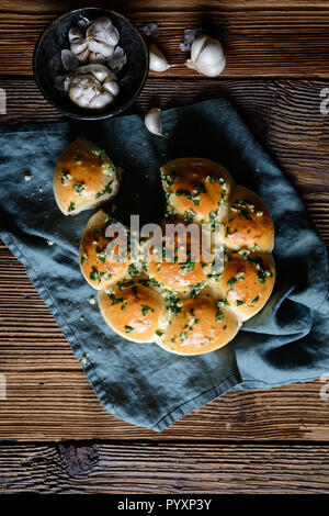 Traditional Ukrainian bread (Pampushky) with garlic and parsley on ...