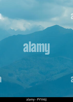 Blue Mountain Crests With Mist Landscape Stock Photo - Alamy