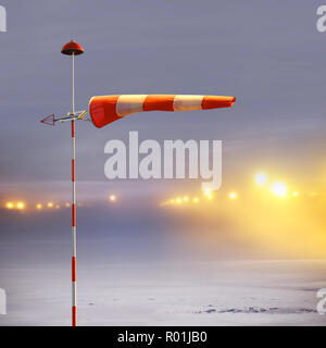 Meteorology windsock inflated by wind in airport at non-flying night ...