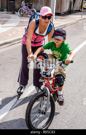 child or youngster on a bike learning to ride child or youngster on a ...