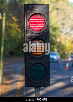 Close-up of temporary portable traffic signal installed for road works ...