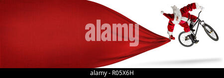 Santa Claus with bag and bicycle on yellow background Stock Photo - Alamy