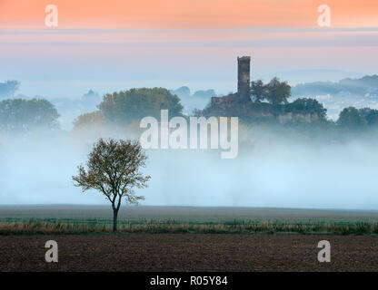 Landscape in North Hesse, morning fog and dawn red, ruins of Altenburg ...
