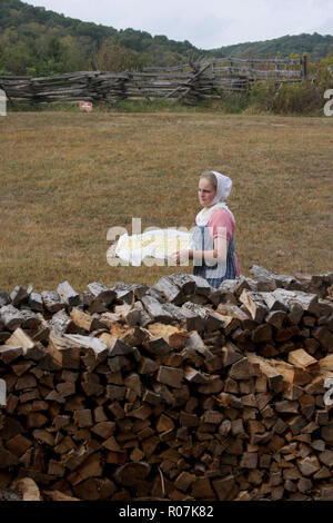 Woman reenactor at the Frontier Culture Museum in Staunton, VA, USA. U ...