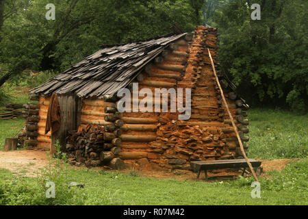 Simple small log house, historical structure from the 1700s displayed ...