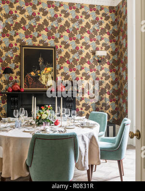 The set of brown table and chairs in the living room with the lake view ...