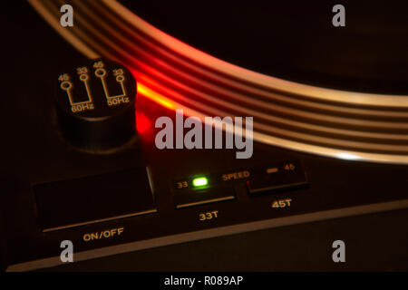 Switches on and off and rotation speed of an old turntable for vintage ...
