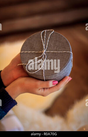 New Year's gifts in designer paper and bright ribbons under the ...