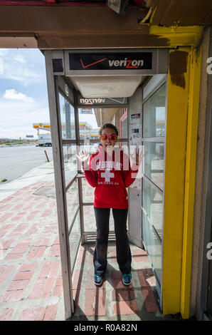 MAY 9 2016 - CABAZON, CALIFORNIA: Adult female makes t-rex arms next to ...