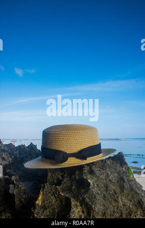 woman beach hat on reef beach summer holiday Stock Photo - Alamy