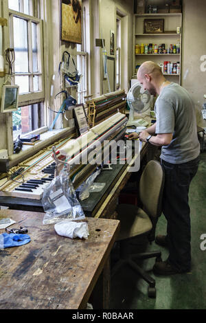 music instrument repair shop in Holland Stock Photo - Alamy