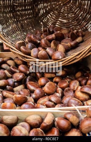 Chestnuts in the shell on a stone plate Stock Photo - Alamy