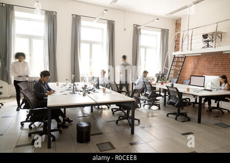 Employees using computers working with staff in office, top view Stock ...