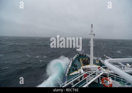Ship cruising in storm and heavy seas crossing the Denmark Strait ...