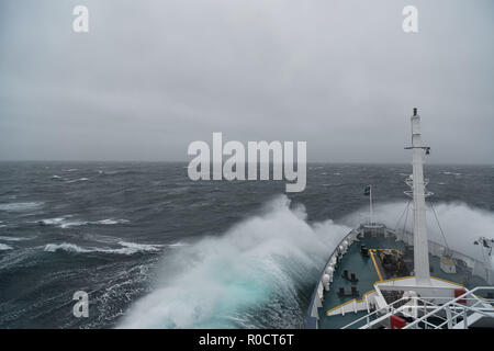 Ship cruising in storm and heavy seas crossing the Denmark Strait ...