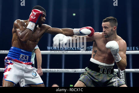 Josh Taylor (right) in action against Ekow Essuman in the WBO Global Welterweight bout at the ...