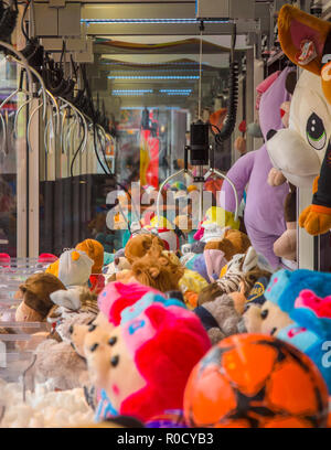 A teddy bear arcade claw crane game vending machine Stock Photo - Alamy