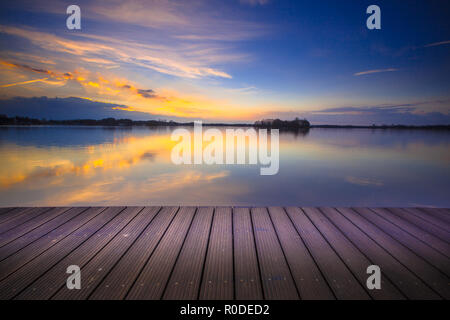 Brand new wooden recreational swimming deck on the lakeside during ...