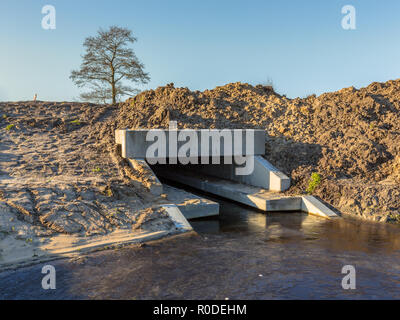 Wildlife crossing culvert pipe underpass for animals under a highway in ...