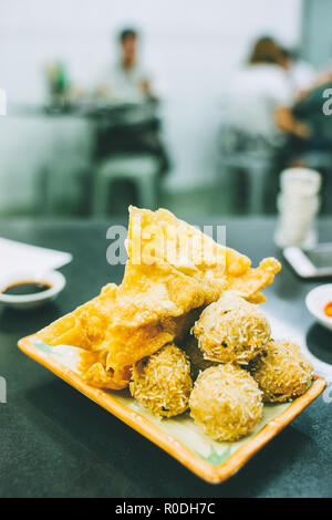Fried wanton and fish ball snack in Macau Stock Photo - Alamy