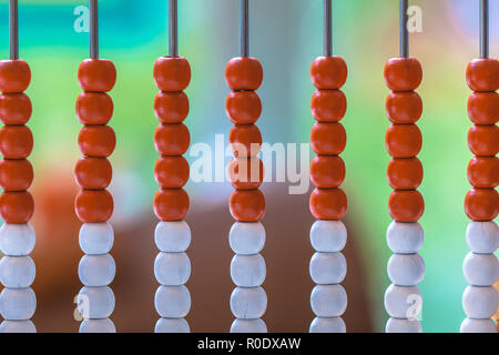 Abacus with Red and White Beads with a vibrant colored Background Stock ...