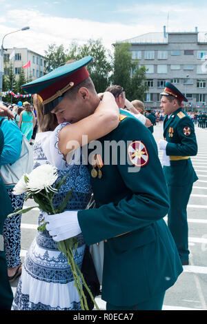 Russia, Novosibirsk -1 July 2016: Mom congratulates son on graduation ...