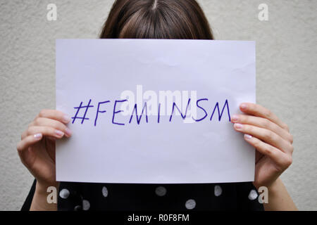 Hashtag Feminism Statement on a white sign Stock Photo - Alamy