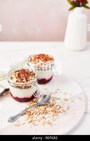 Delicious breakfast of yogurt and cereal muesli. Close-up Stock Photo ...