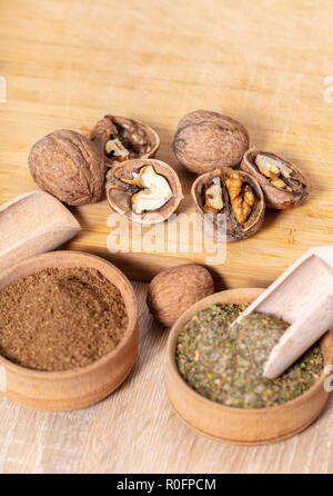 walnuts and dry spices close-up on wooden background Stock Photo - Alamy