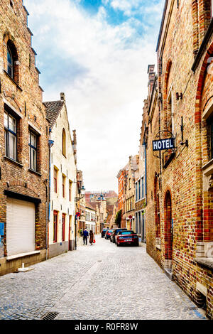 Cobblestone street lined with old Gothic stone buildings in the village ...